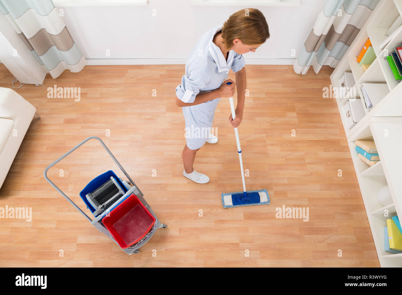 Female Cleaner Cleaning With Mop Stock Photo - Alamy