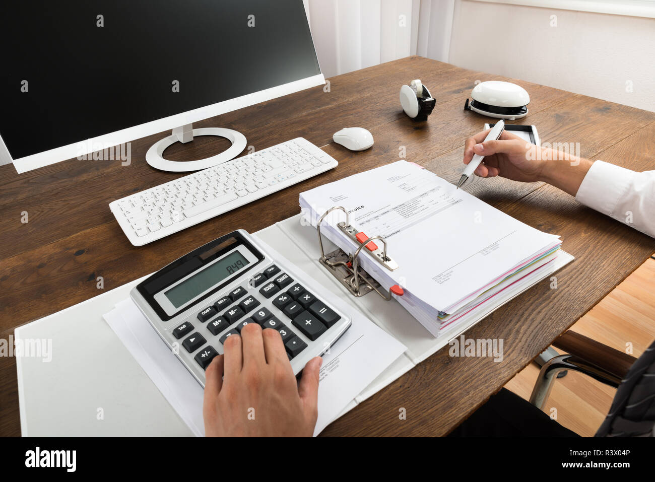 Businessman Checking Invoice With Calculator Stock Photo - Alamy