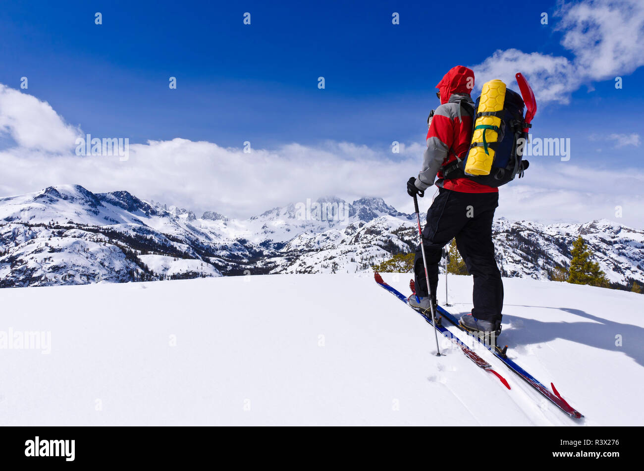 Backcountry skier under Banner and Ritter Peaks in the Ansel Adams ...