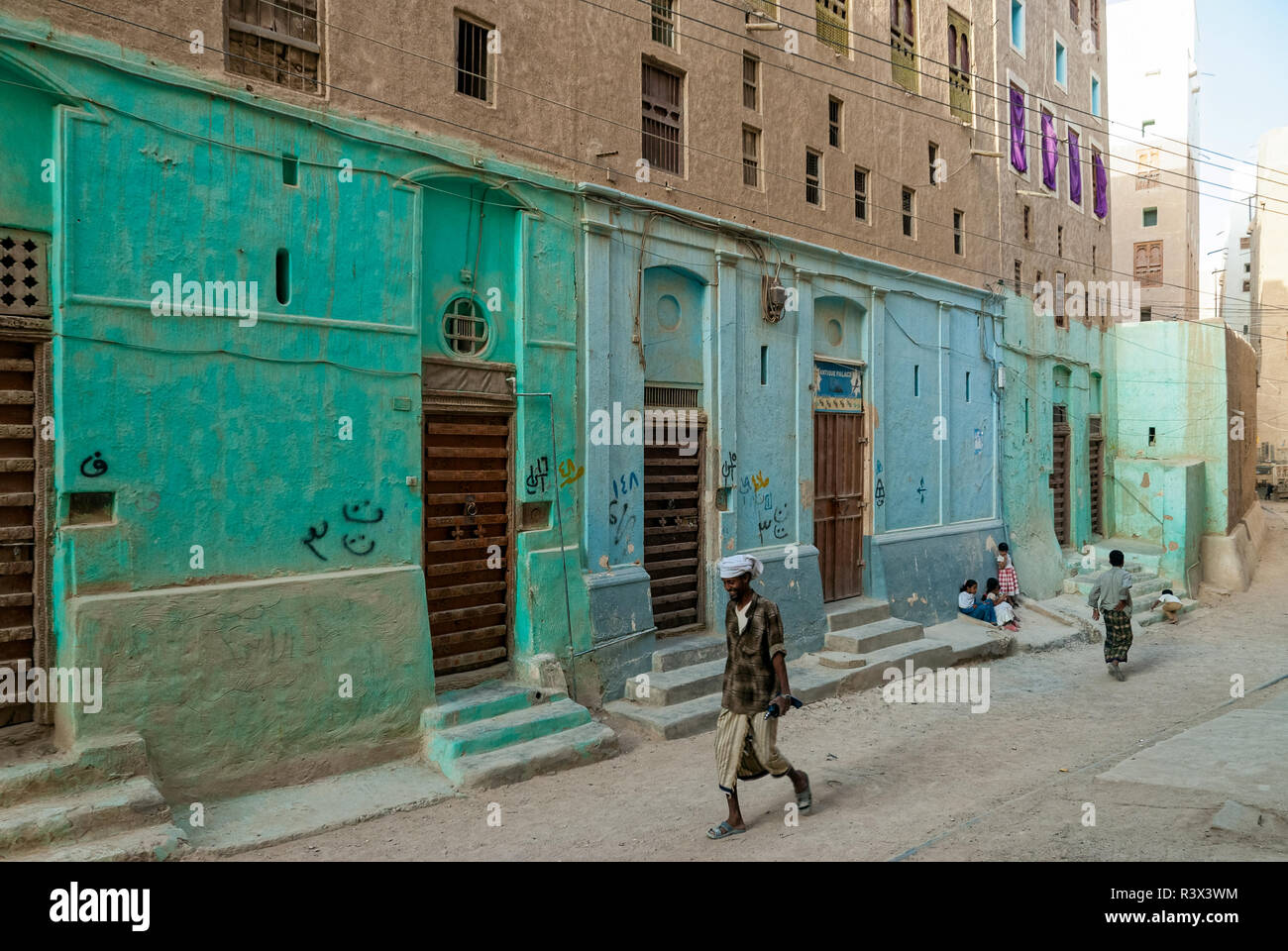 A man in traditional clothes walks in a street on May 8, 2007 in Shibam ...