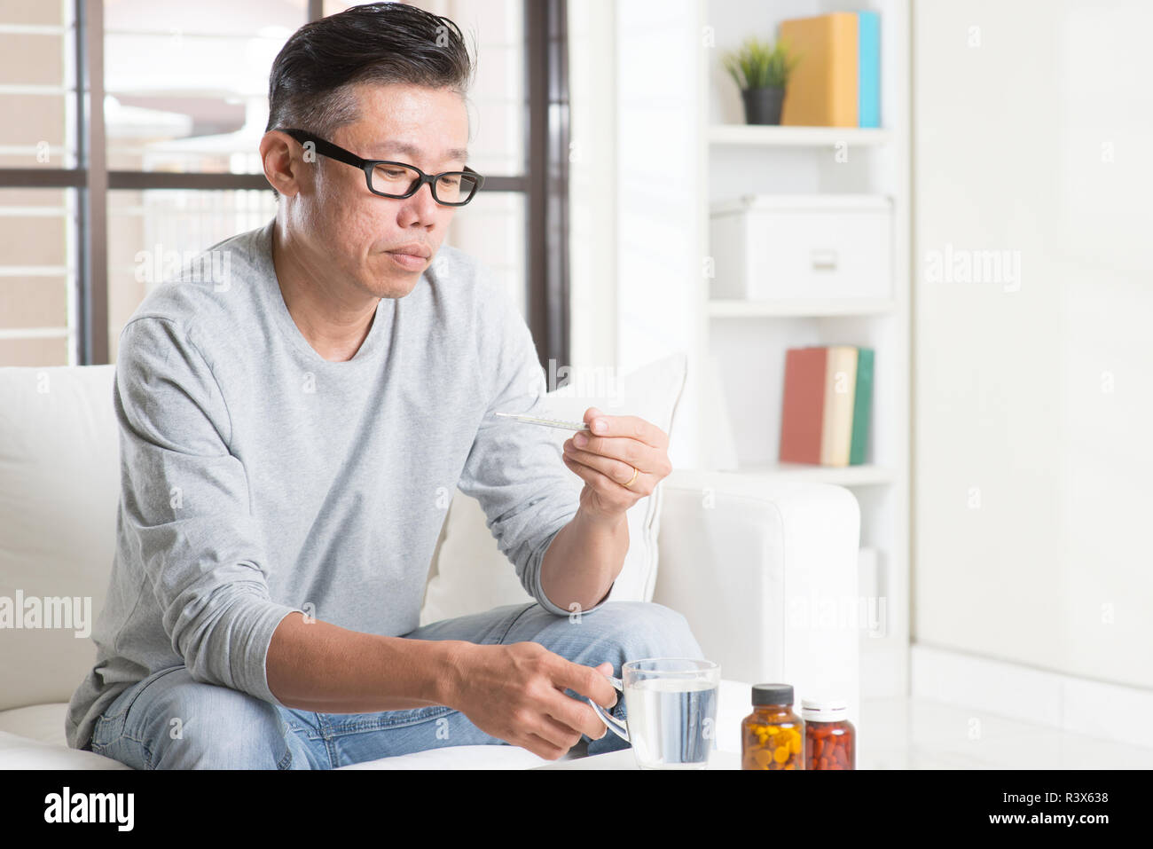 Mature man fever Stock Photo - Alamy