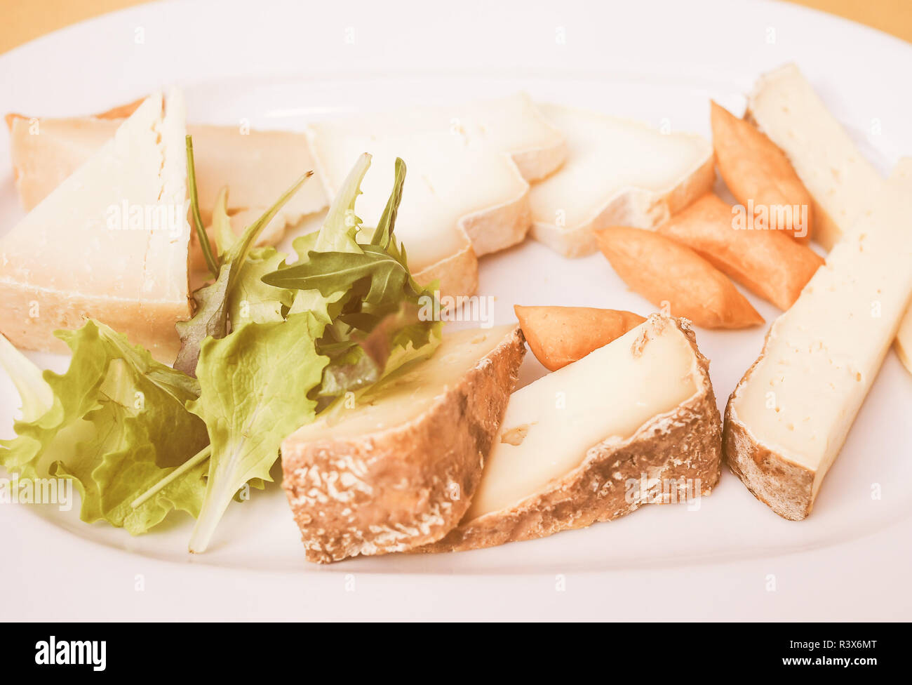 Retro looking Cheese platter Stock Photo - Alamy