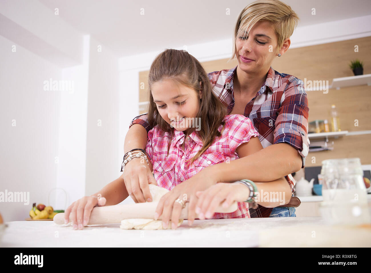 Happy mother and daughter making dinner. Cooking together Stock Photo ...