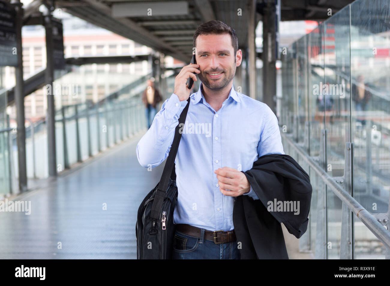Young attractive business man using smartphone Stock Photo - Alamy