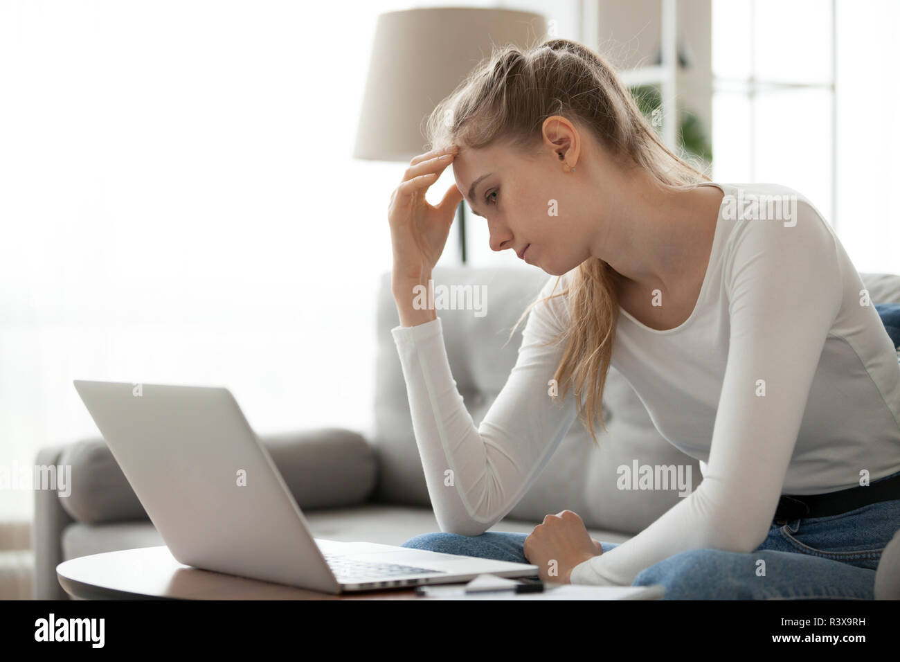 Frustrated female feel irritated having laptop problems Stock Photo - Alamy