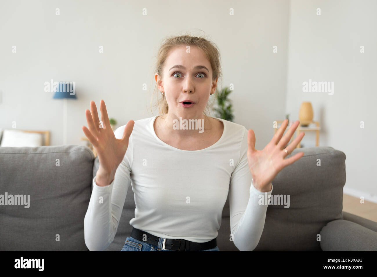 Excited young woman emotionally talk making video call Stock Photo - Alamy