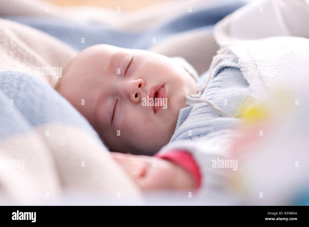 Adorable baby sleeping between sheets Stock Photo - Alamy Adorable baby sleeping between sheets Stock Photo - Alamy