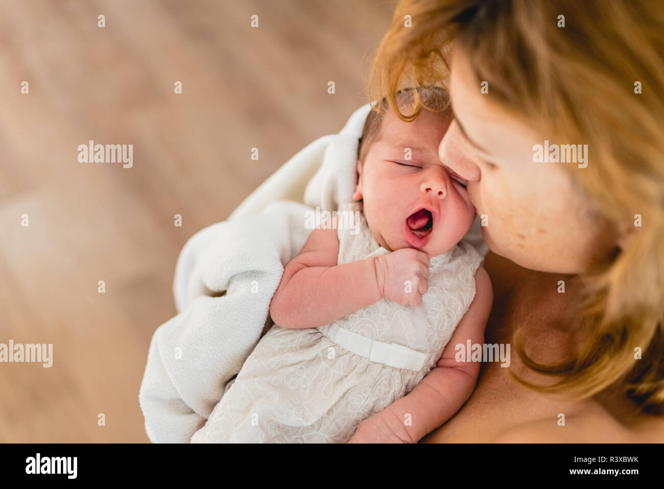 Newborn baby yawning Stock Photo - Alamy