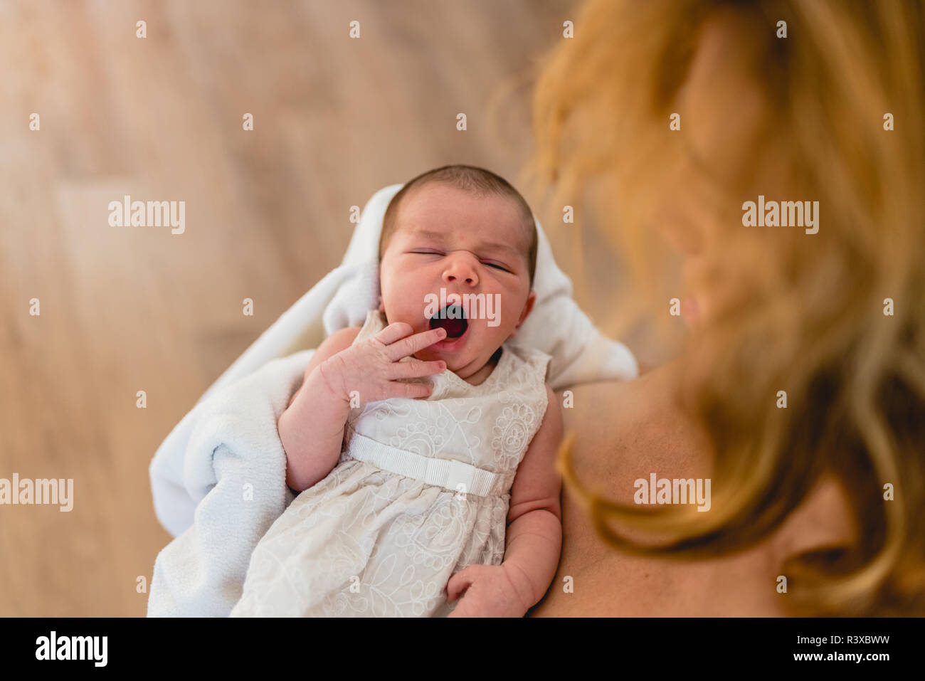Newborn baby yawning Stock Photo - Alamy