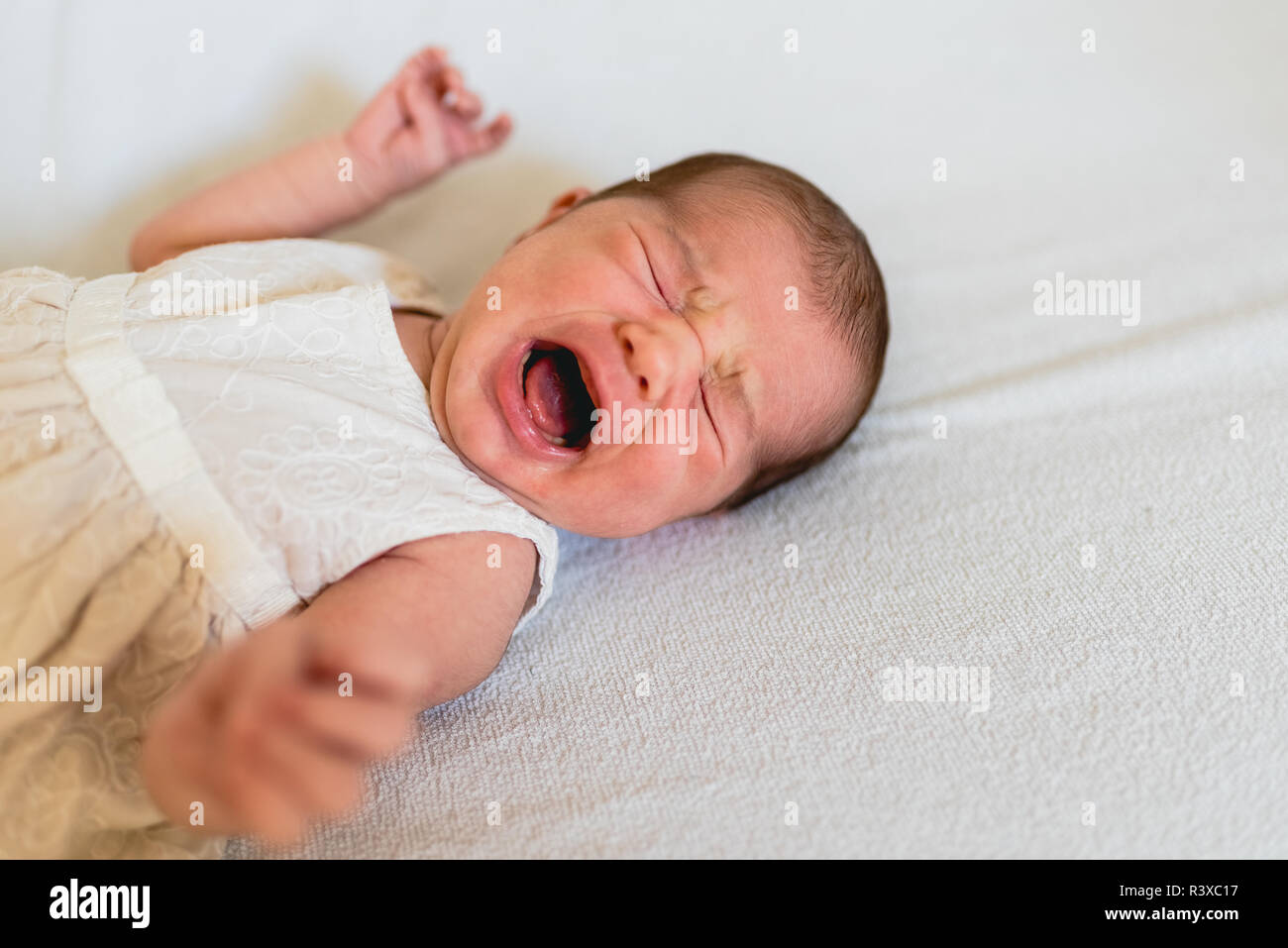 Newborn baby crying for fear Stock Photo - Alamy