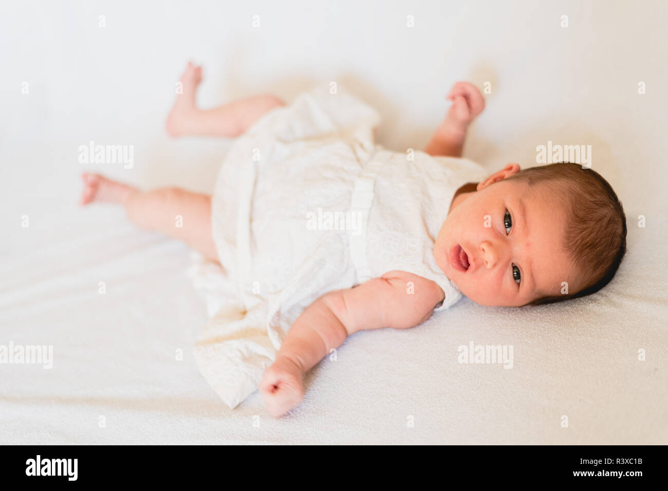 Face portrait of a newborn baby, calm and relaxed Stock Photo - Alamy