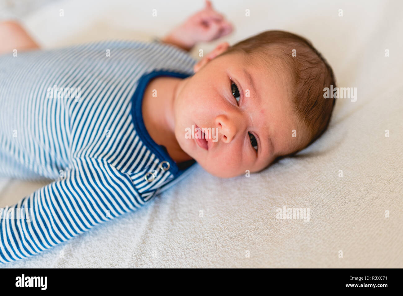 Face portrait of a newborn baby, calm and relaxed Stock Photo - Alamy