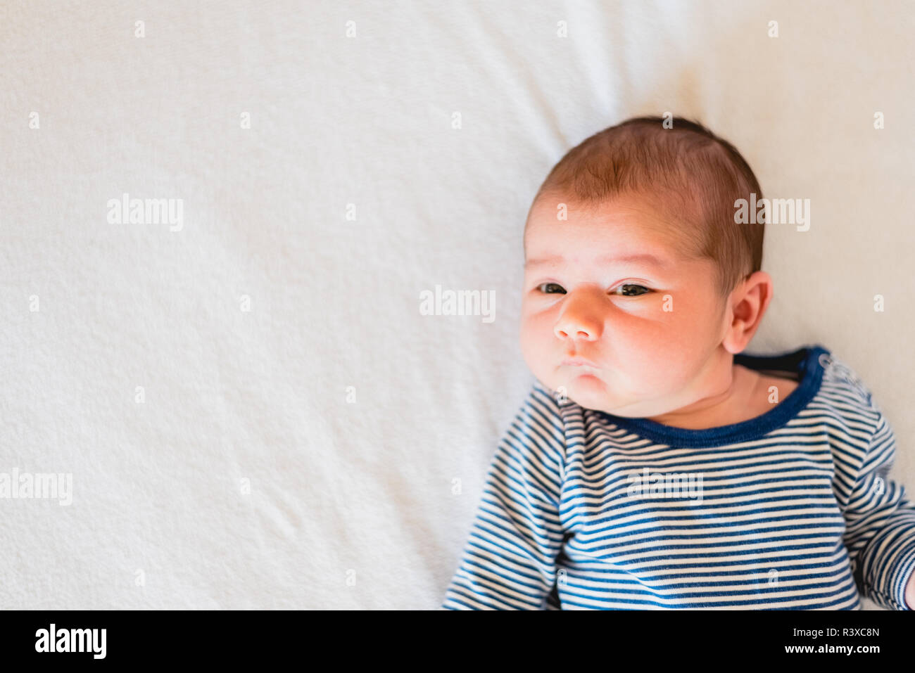 Face portrait of a newborn baby, calm and relaxed Stock Photo - Alamy
