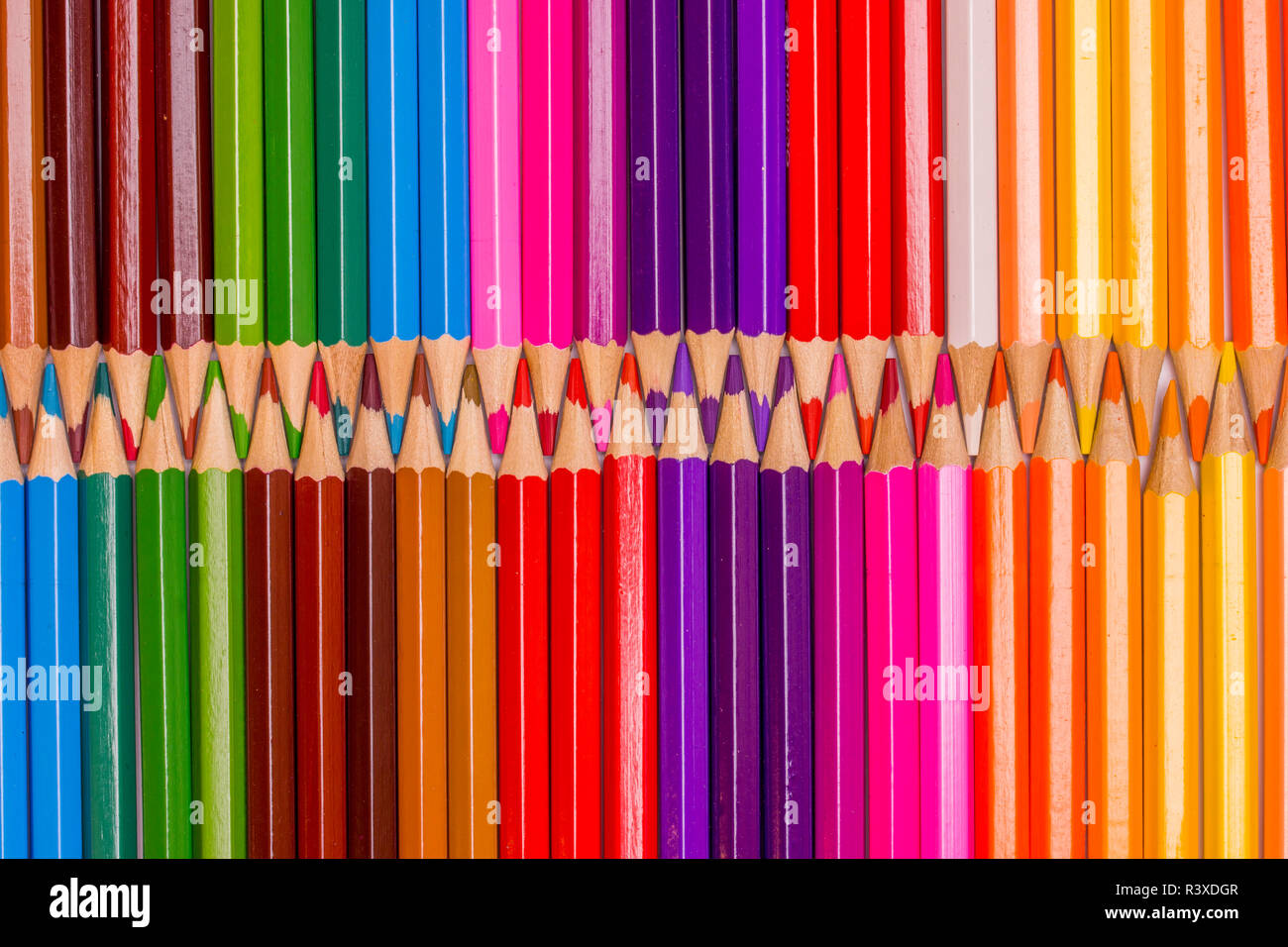 Brightly coloured pencils in rainbow colours in a row Stock Photo - Alamy