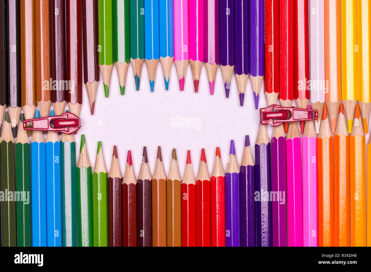 Creative still life concept made of colorful pencils to look like a zip ...