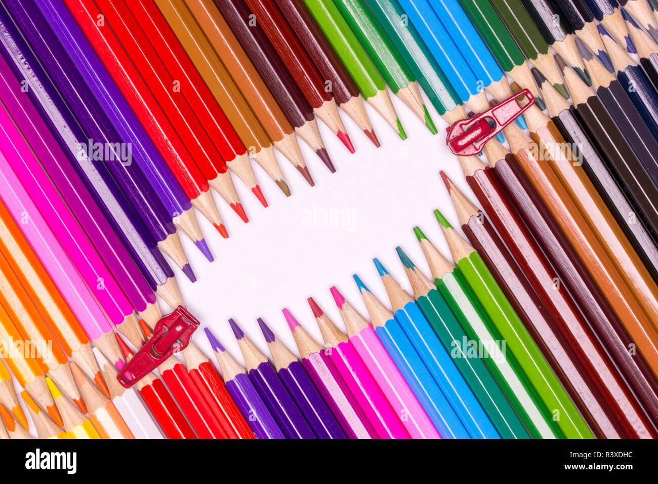 Creative still life concept made of colorful pencils to look like a zip ...