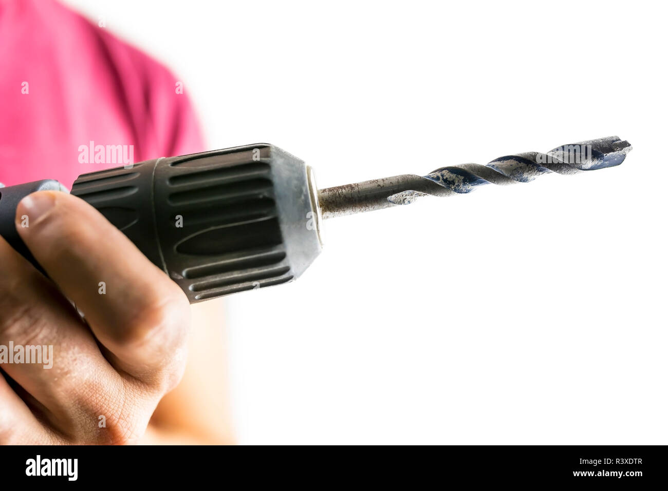 Closeup of man holding drilling machine. Isolated over white background ...