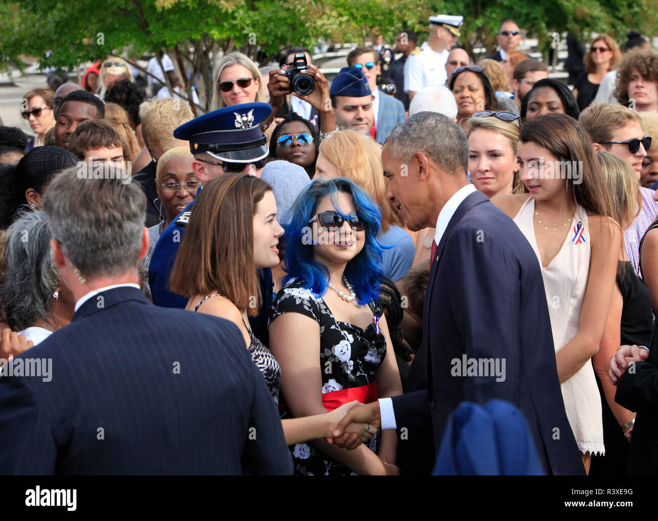 President Barack Obama shakes hands with guests at the Memorial ...