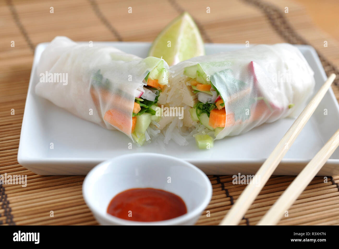 Woman eating vietnamese spring rolls hi-res stock photography and ...