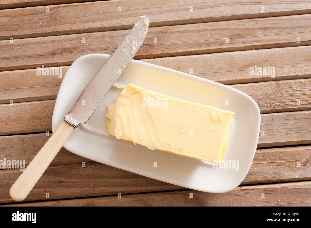 Pat of fresh farm butter on a dish Stock Photo - Alamy