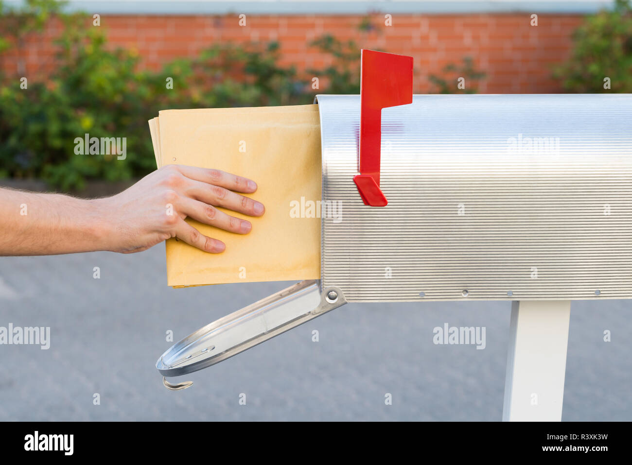 Person Putting Letters In Mailbox Stock Photo - Alamy