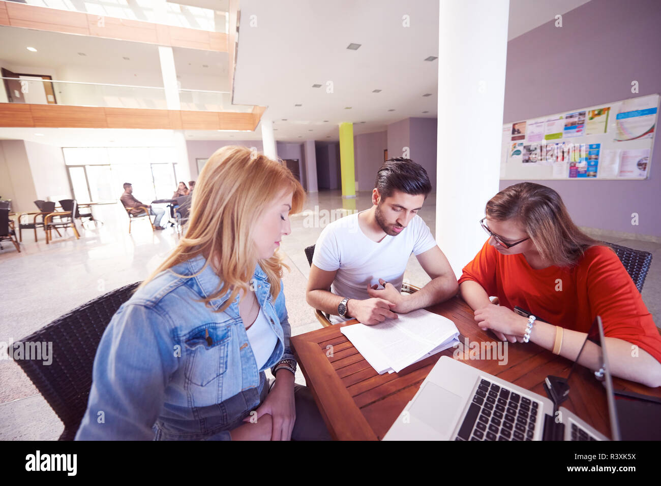 students group working on school project together Stock Photo - Alamy