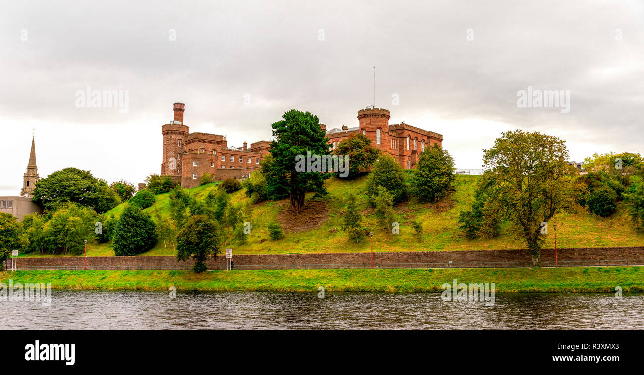 Panorama of river Ness promenade with a scenic red stone Inverness ...