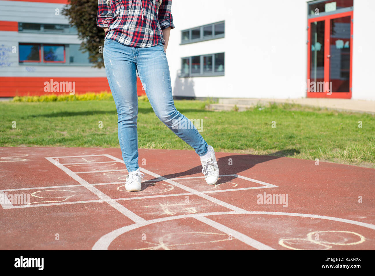 Girl playing Hopscotch Stock Photo - Alamy