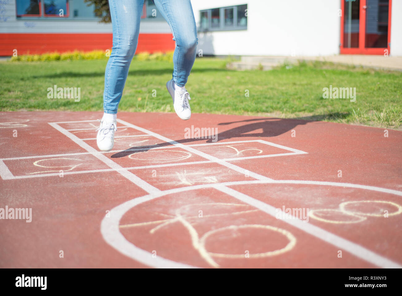 Girl playing Hopscotch Stock Photo - Alamy