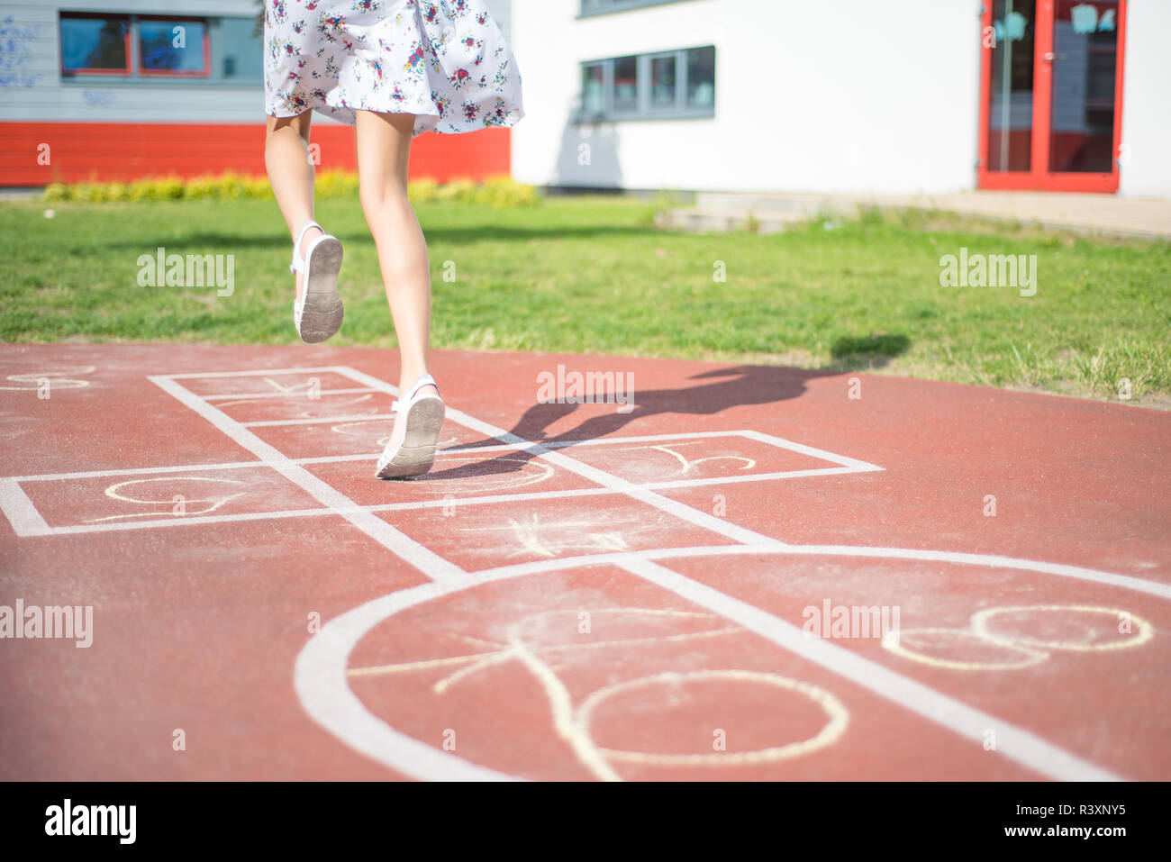 Girl playing hopscotch hi-res stock photography and images - Alamy