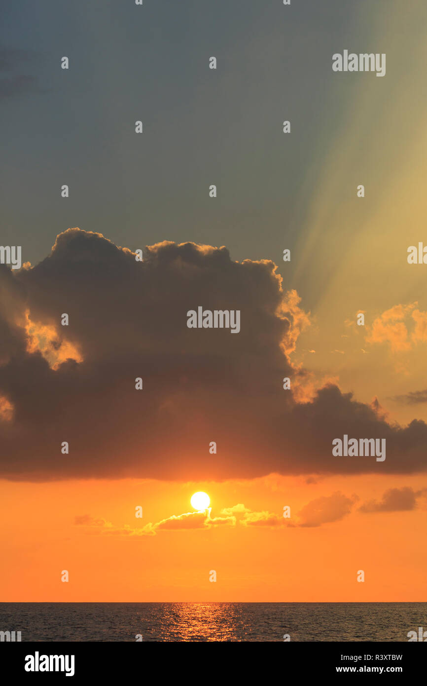 Sun setting on ocean off Maui, Hawaii, USA Stock Photo - Alamy