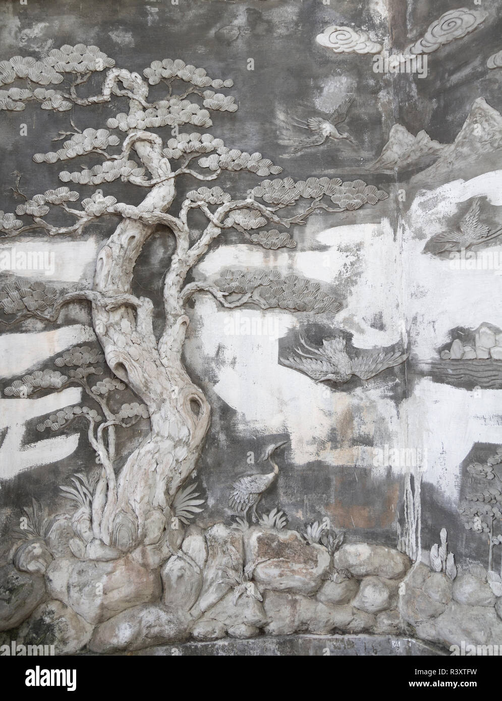 oriental tree basrelief on wall Stock Photo - Alamy