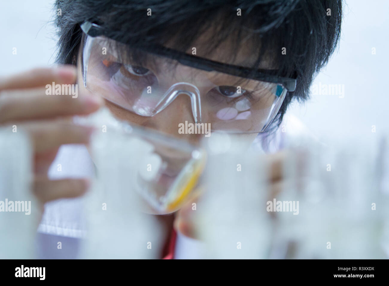 Researcher checking chemical Stock Photo - Alamy
