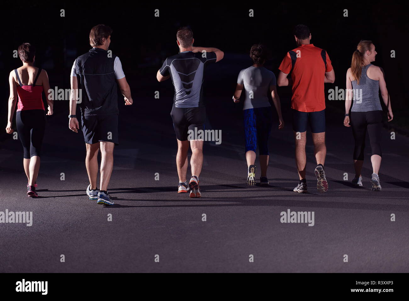 people group jogging at night Stock Photo - Alamy
