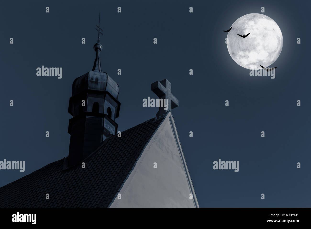 Night sky and the moon behind the church Stock Photo - Alamy