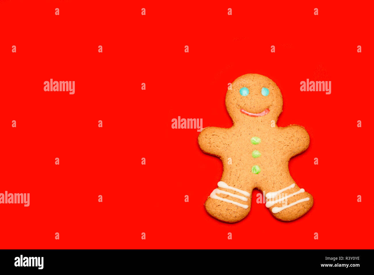 Iced Christmas Gingerbread man sugar cookie on red background Stock ...