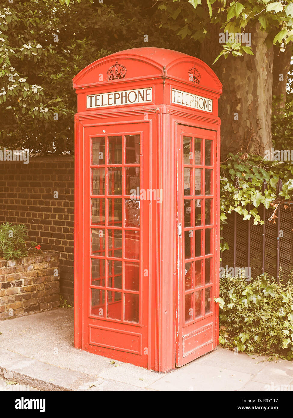 Retro looking Red phone box in London Stock Photo - Alamy