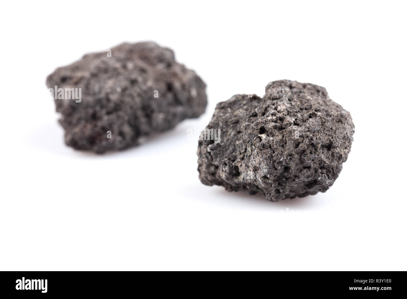 Volcanic stones on a white background Stock Photo - Alamy