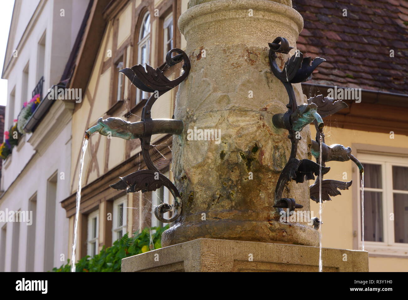 fountain in front of the catholic parish church sankt johannis Stock ...