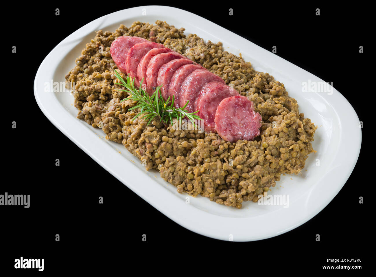 Cotechino (pork sausage) with lentils. Traditional Italian dish Stock ...