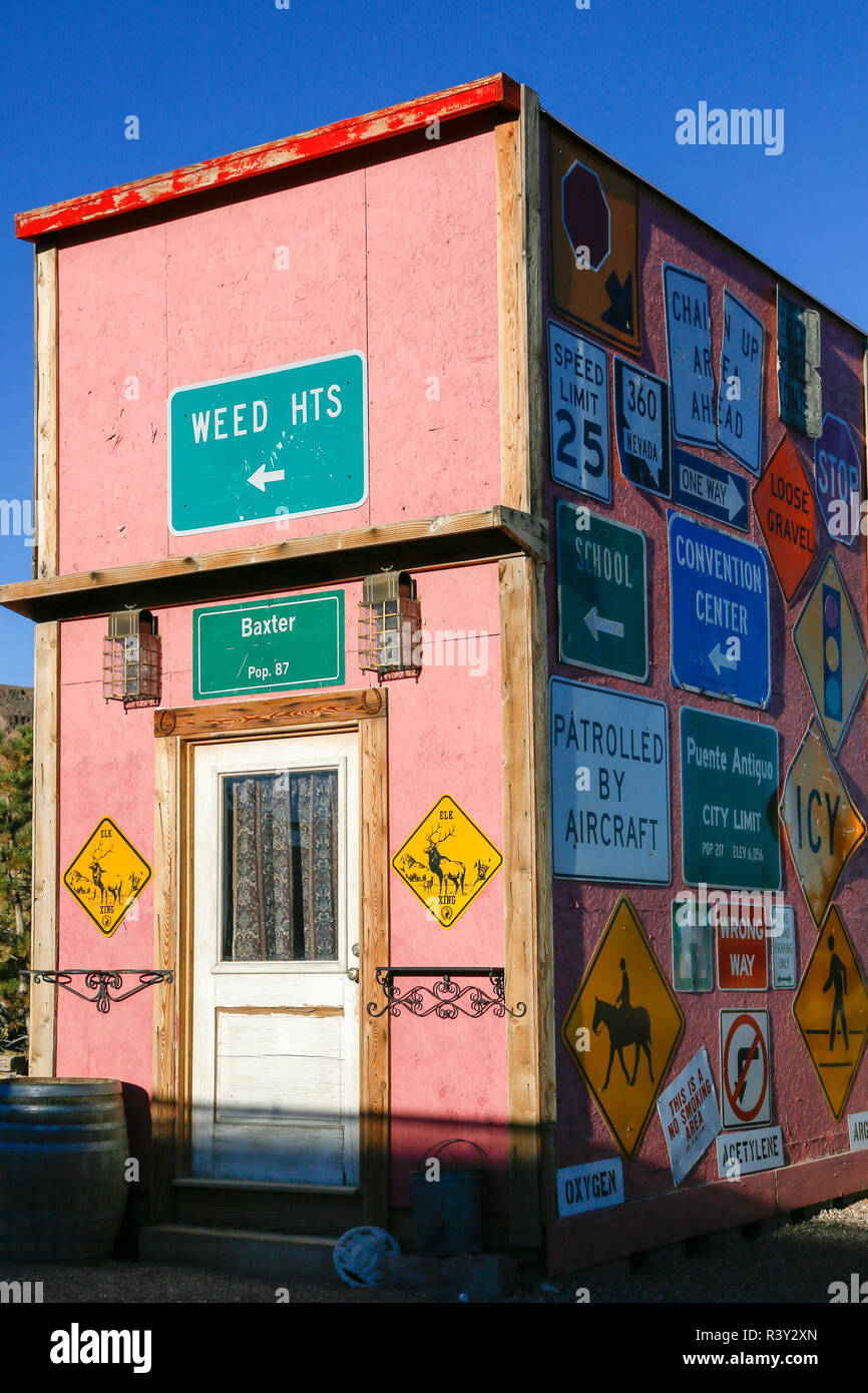 Pink building covered in road signs, Goldfield, Nevada, USA Stock Photo ...