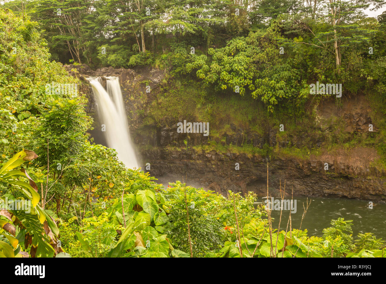 USA, Hawaii, Rainbow Falls. Waterfall and tropical landscape Stock ...
