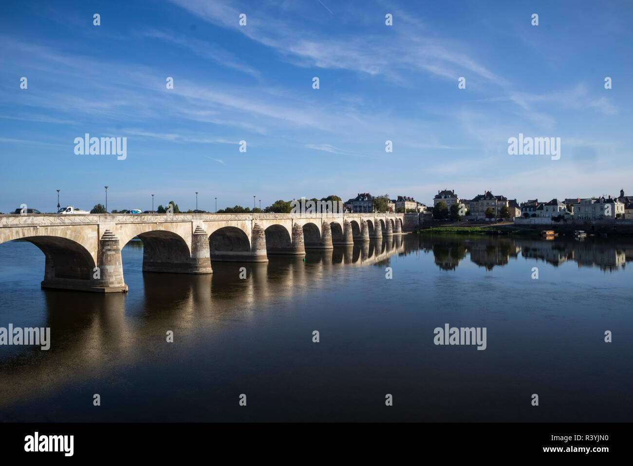 The multi arched road bridge across the River Loire at Saumur in the ...