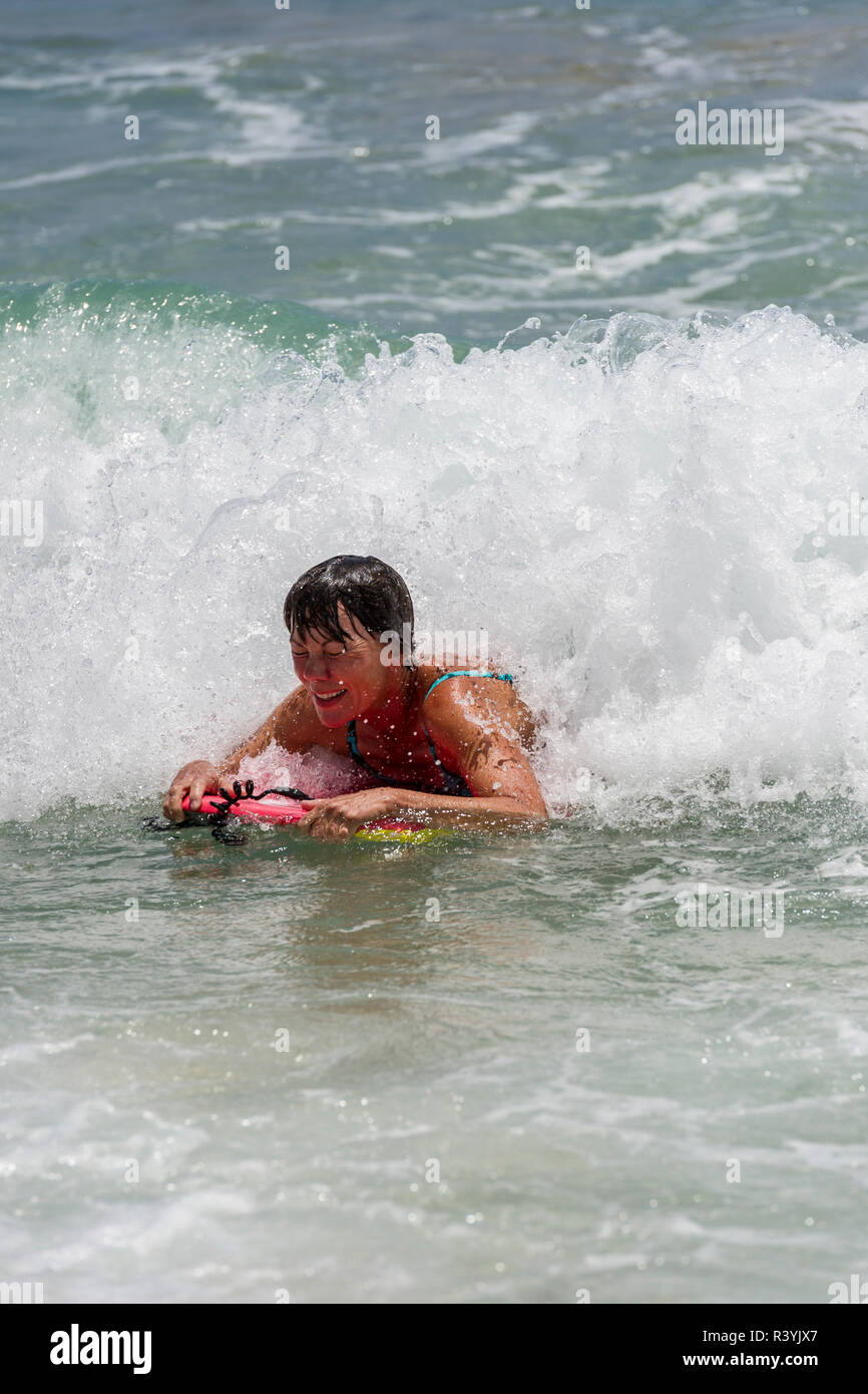 Woman boogie boarding. (MR Stock Photo - Alamy