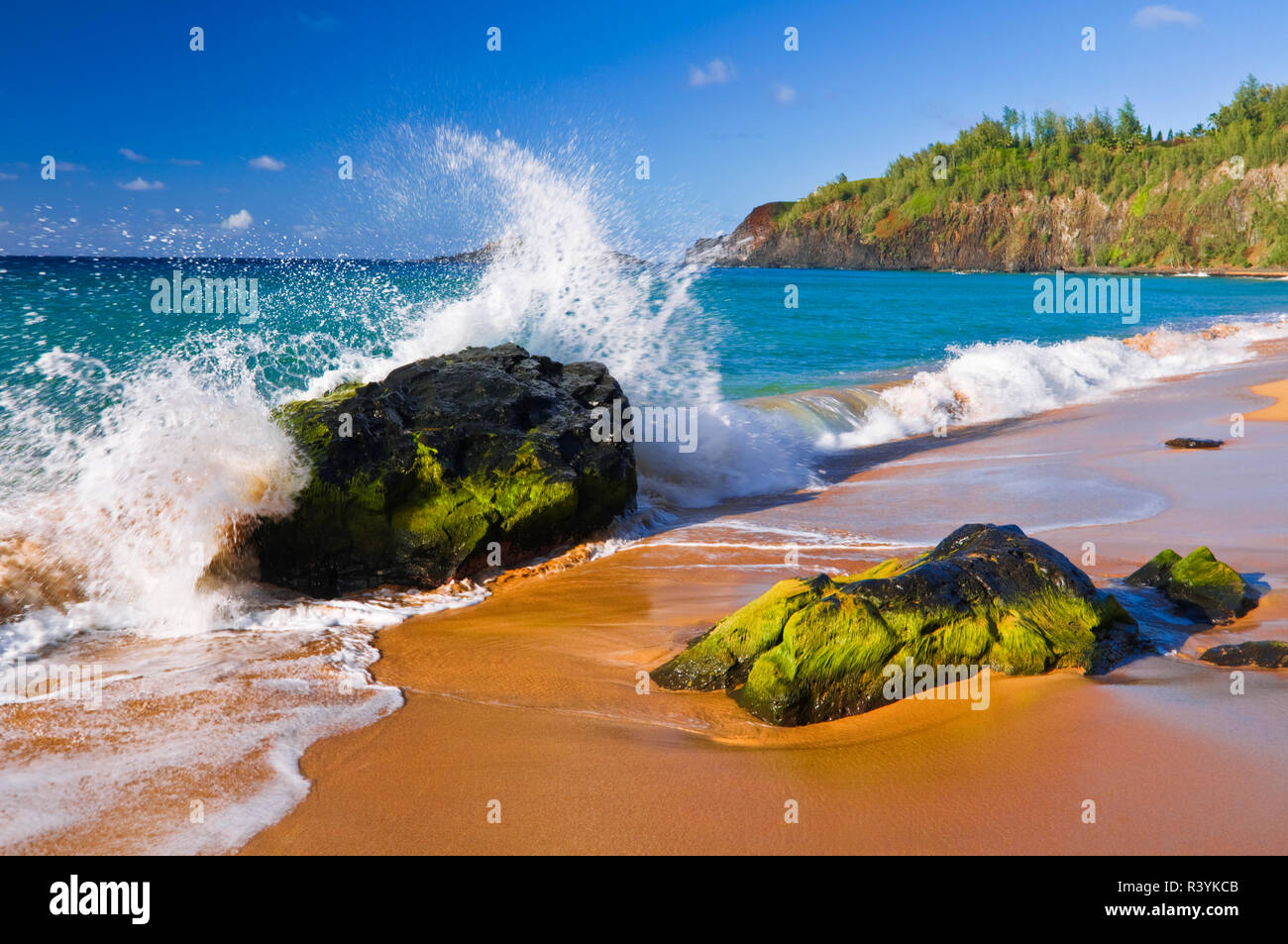 Surf crashing on lava rocks at Secret Beach (Kauapea Beach), Kilauea ...