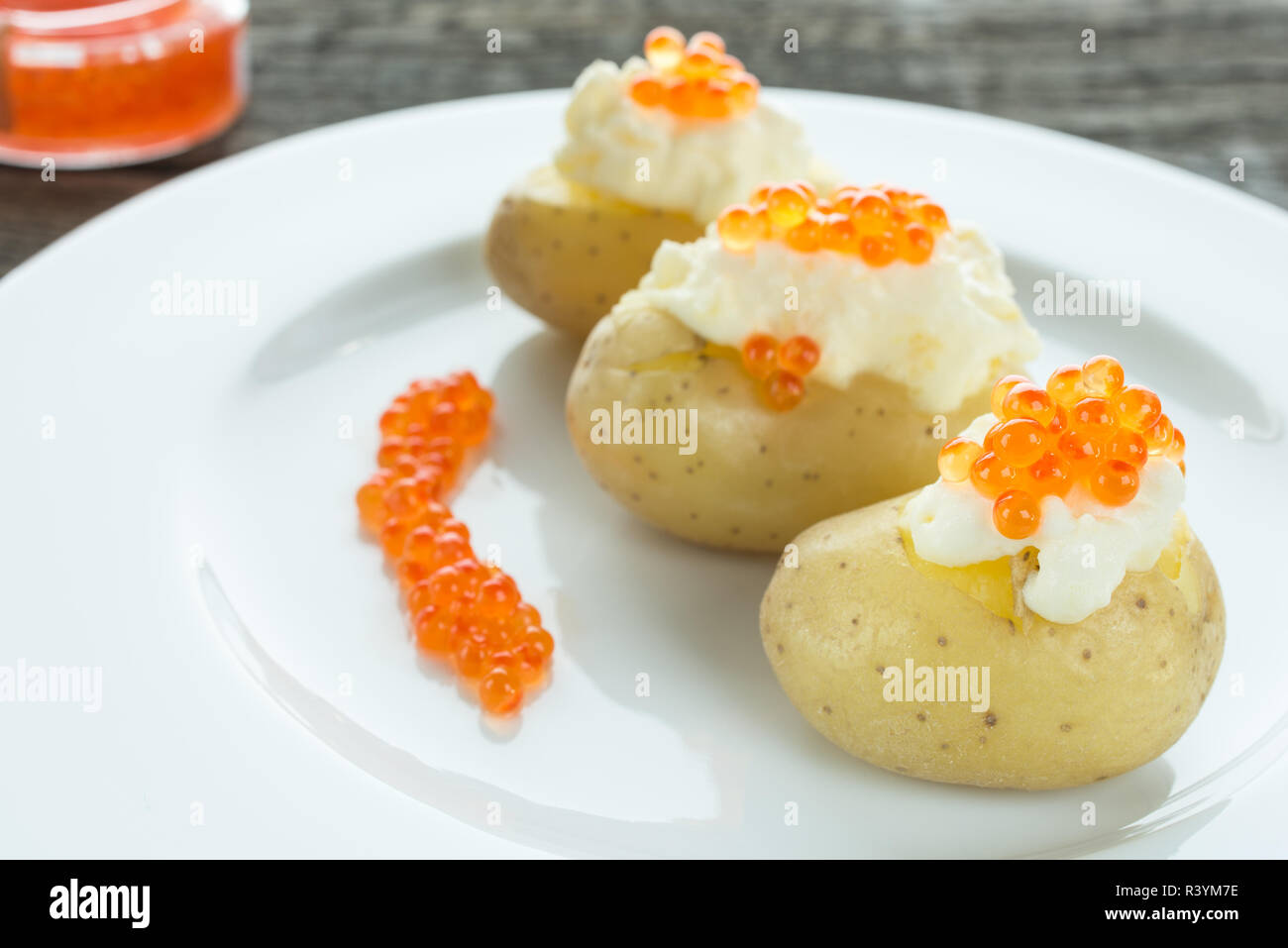 delicacy caviar on potato Stock Photo - Alamy
