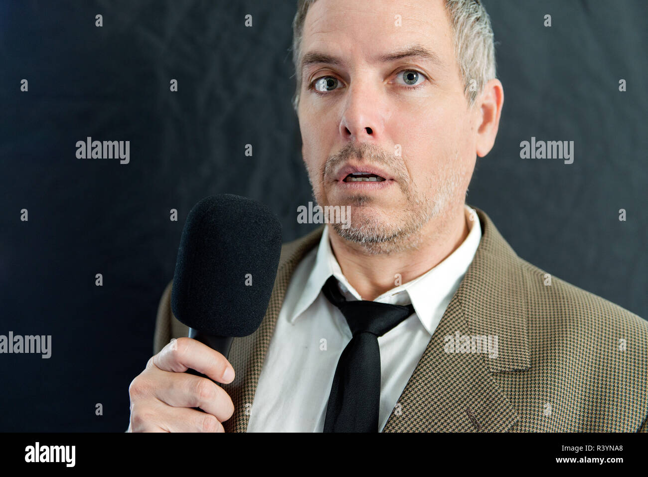 Nervous Man Microphone High Resolution Stock Photography and Images - Alamy