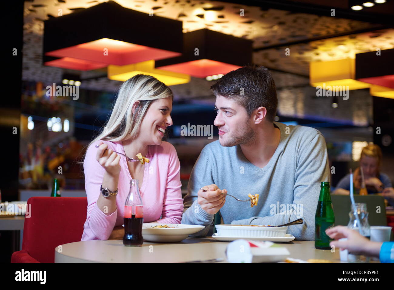 couple having lunch break in shopping mall Stock Photo - Alamy