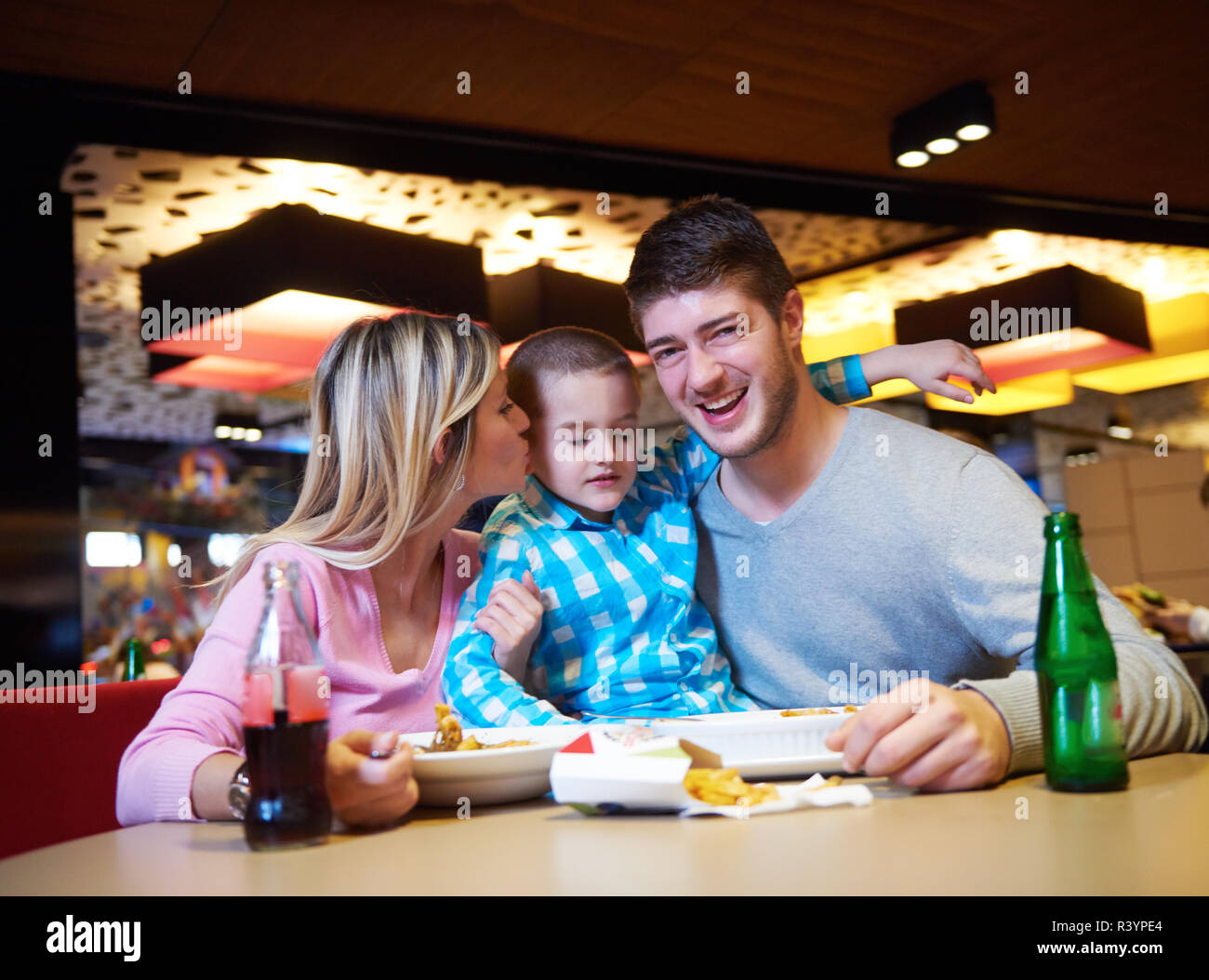 family having lunch in shopping mall Stock Photo - Alamy