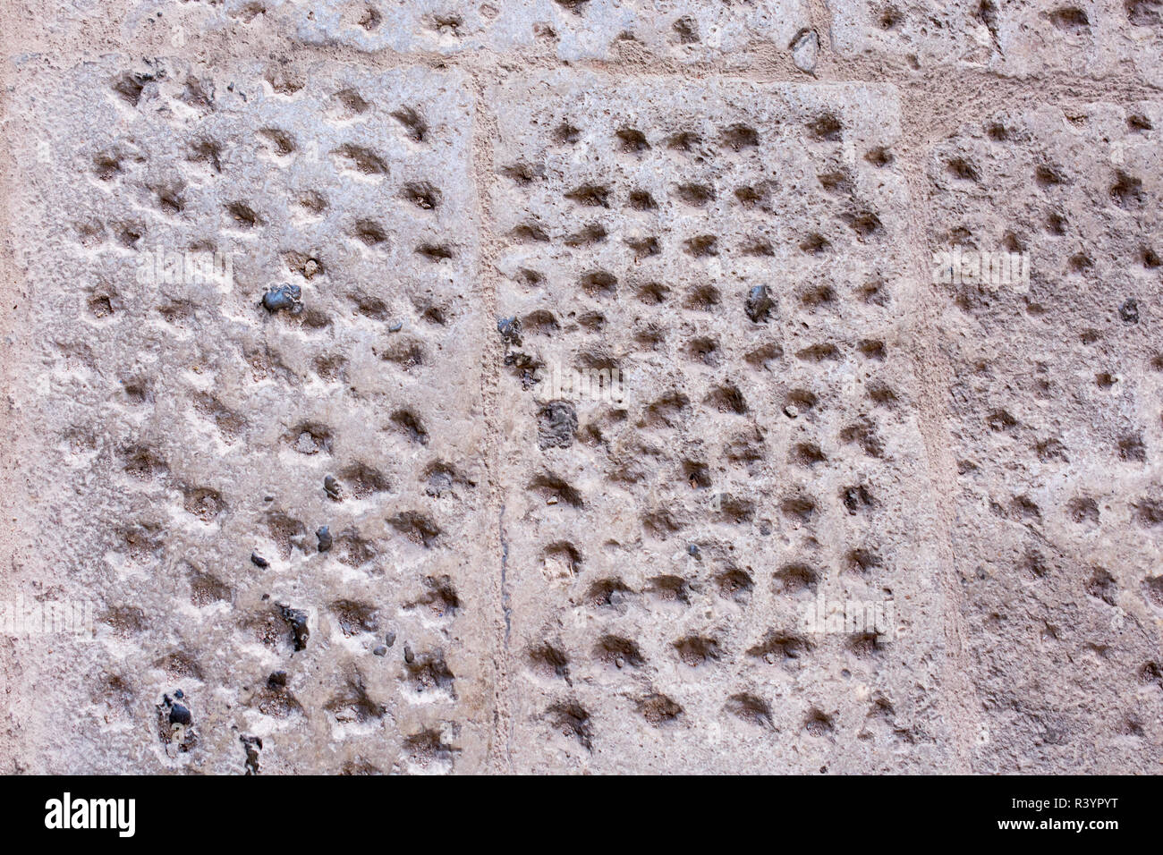 Natural rock or Stone with a dented surface as background Stock Photo ...
